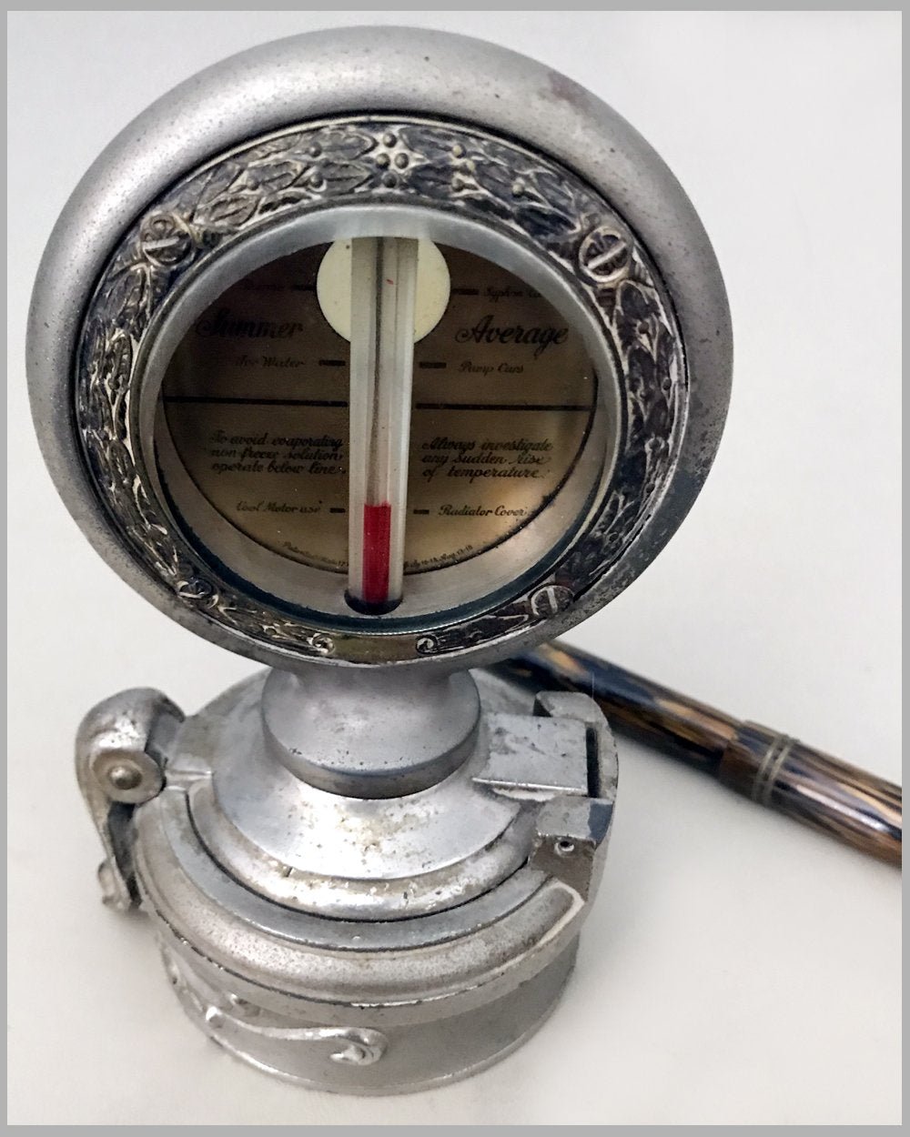 Large standard motometer by Boyce with attached revolving decorative h ...